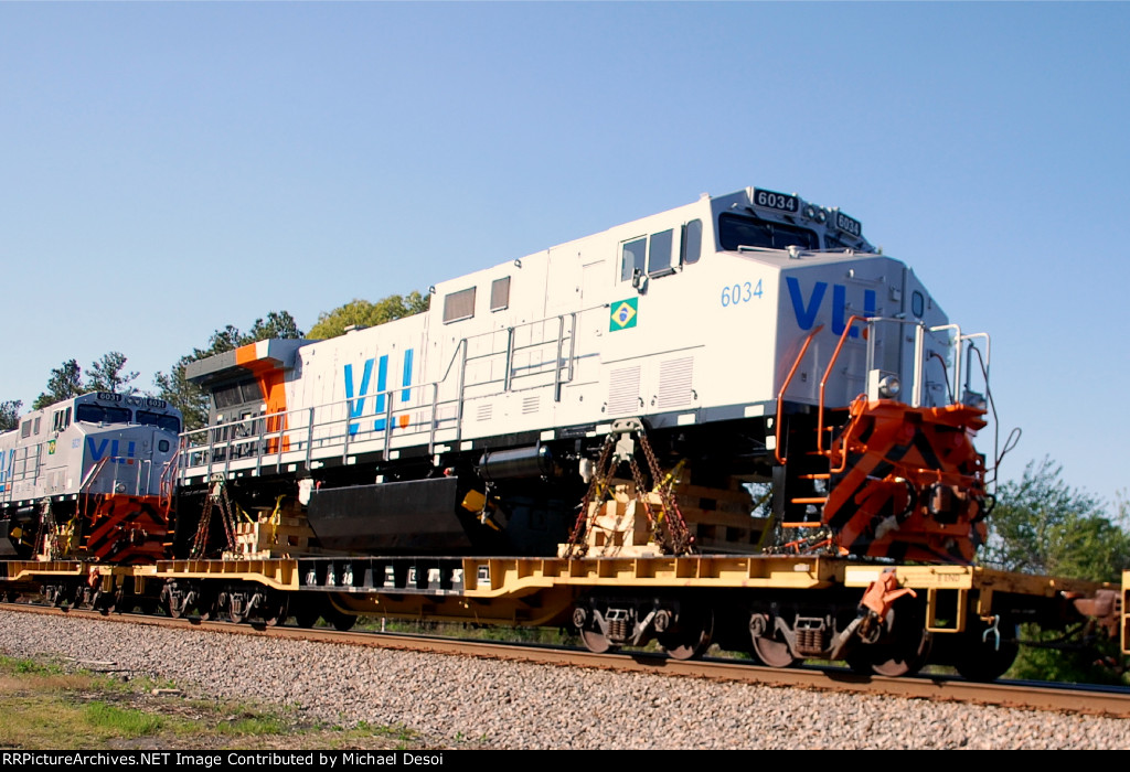VLI BB40-9WM #6034 is one of 8 locomotives in this train heading east bound for the port of ...